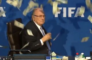 FIFA Press Conference Interrupted by a Prankster Throwing Money in the Air
