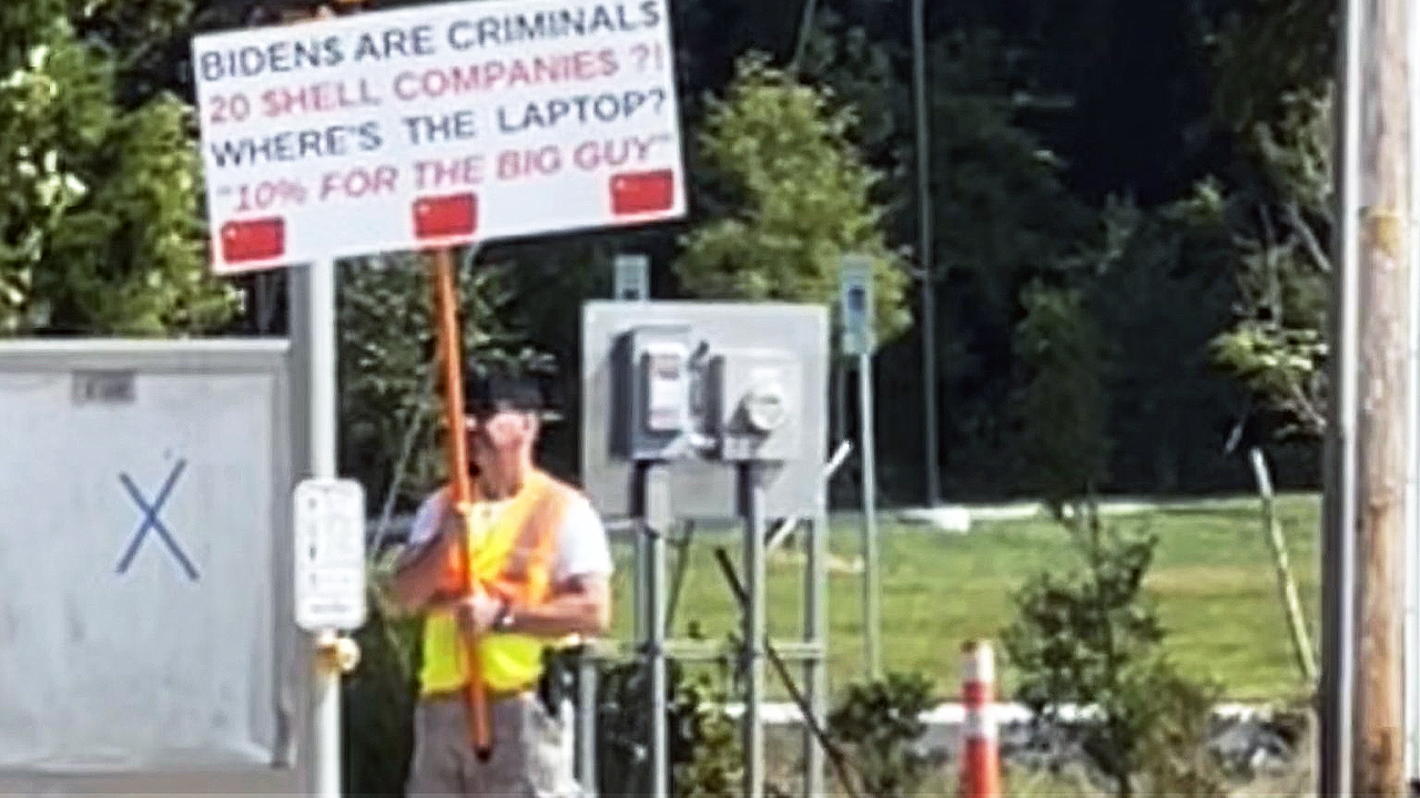 Protester With Gun and Anti-Biden Sign At President's Delaware Home